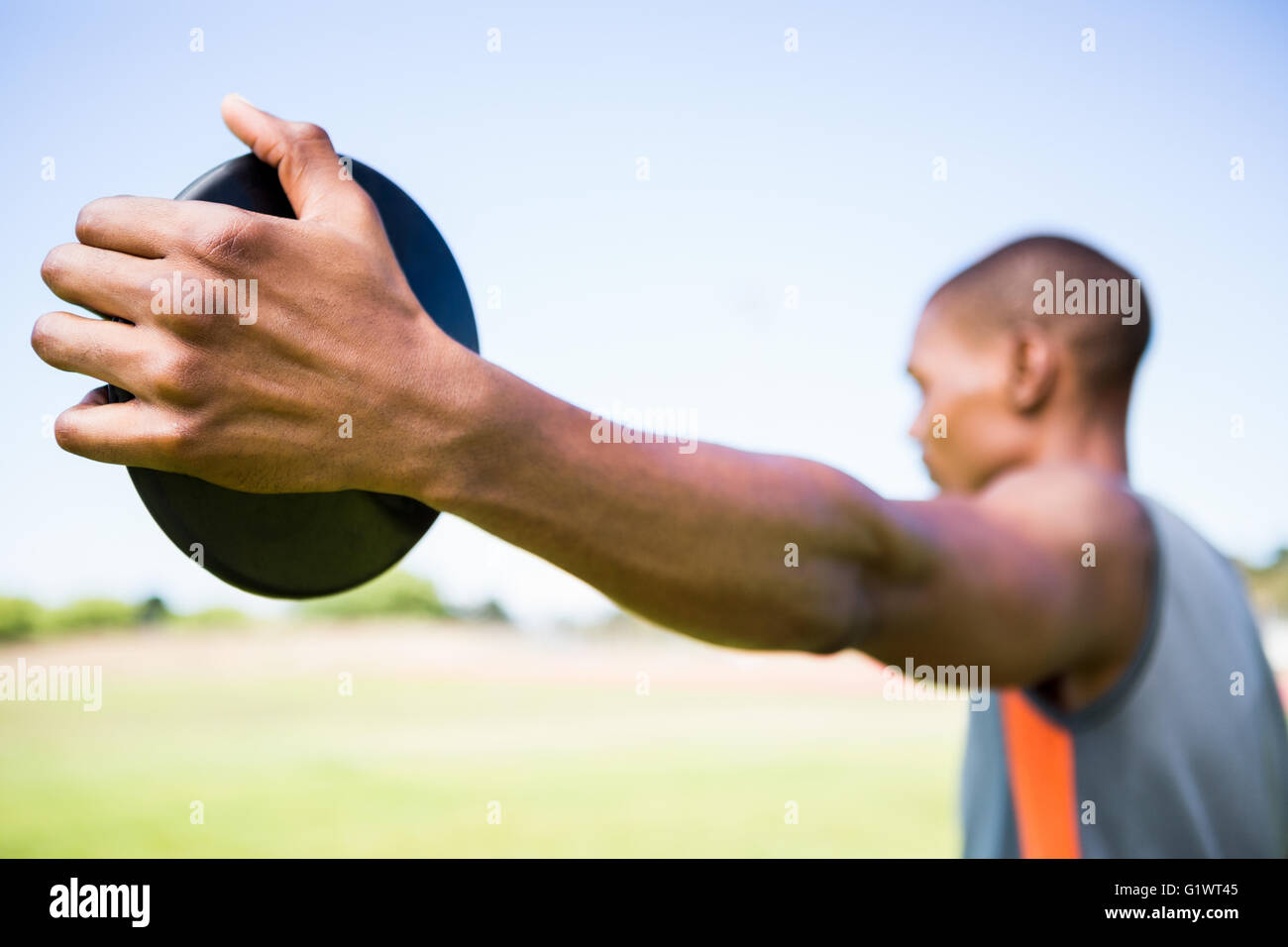 Athlete holding a discus Stock Photo - Alamy