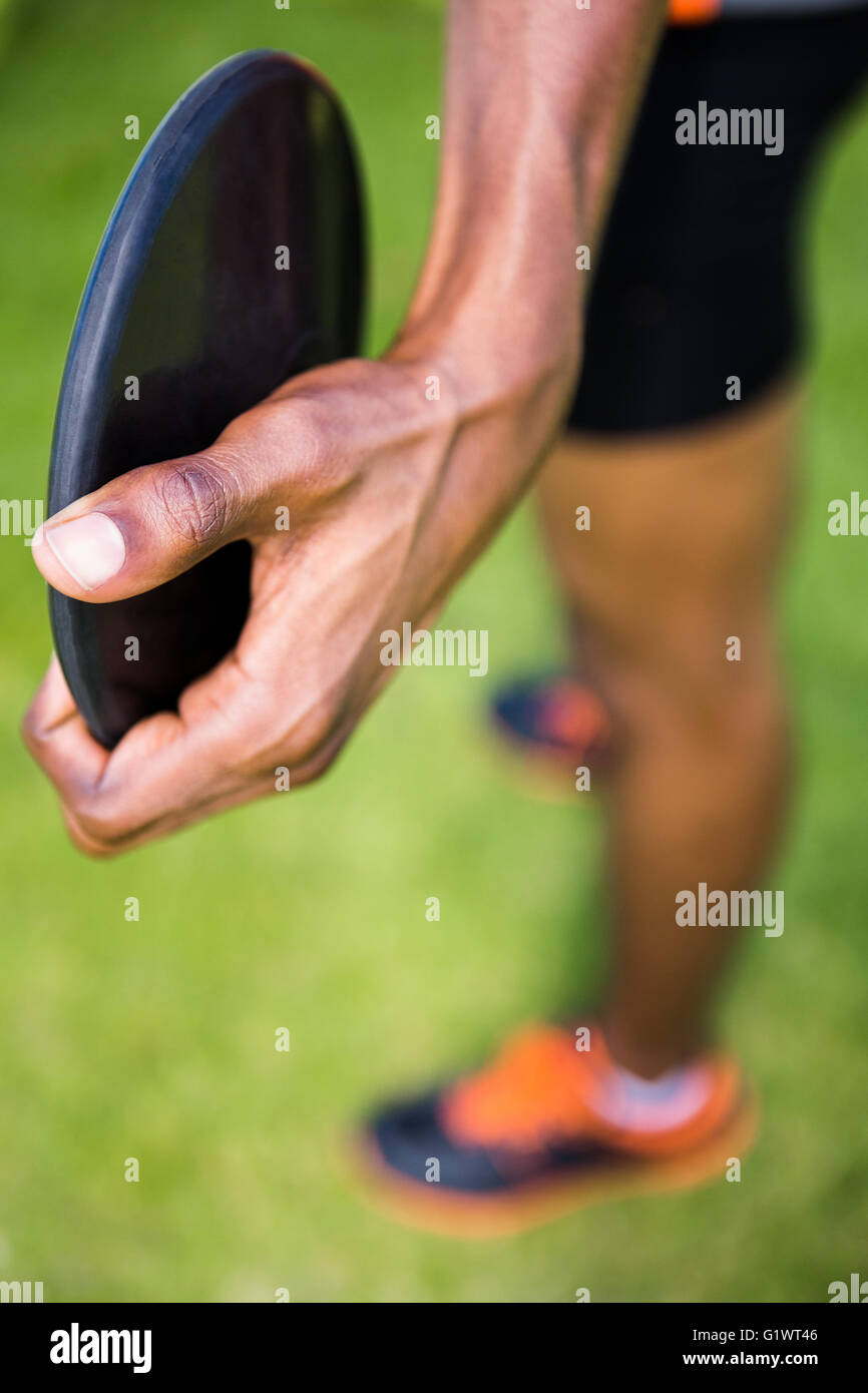 Close-up of athlete holding a discus Stock Photo - Alamy