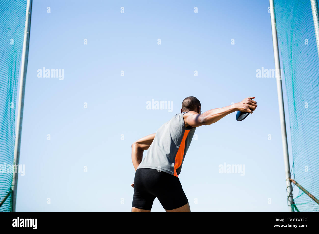 Athlete about to throw a discus Stock Photo - Alamy