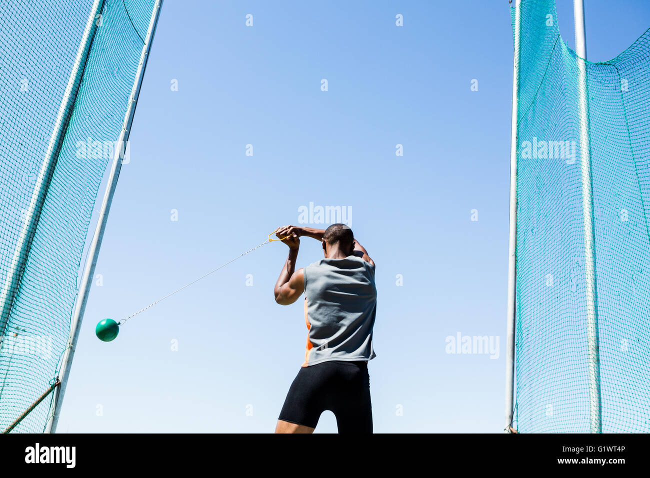 Athlete performing a hammer throw Stock Photo - Alamy