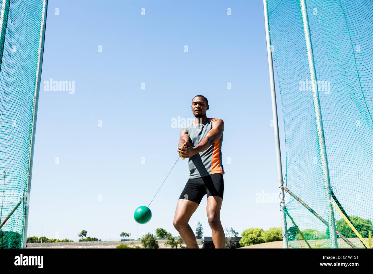 Athlete performing a hammer throw Stock Photo - Alamy