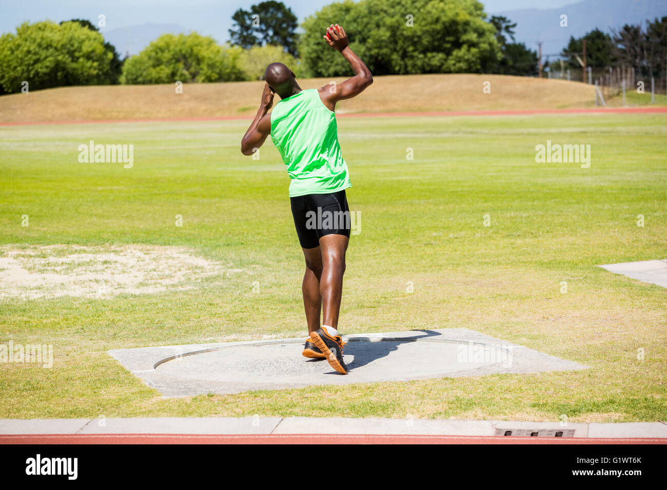Male athlete preparing to throw shot put ball Stock Photo - Alamy