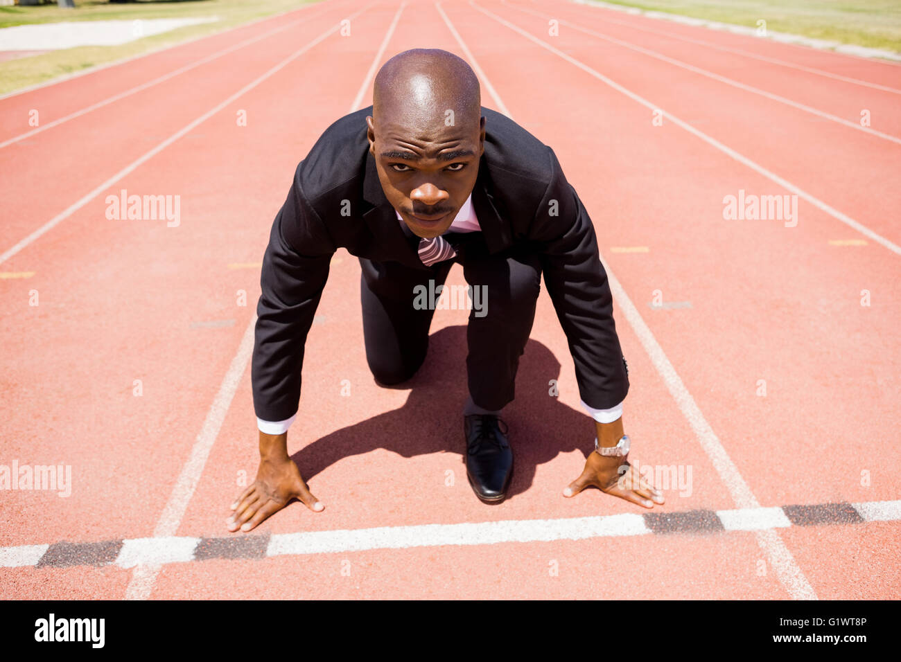 Businessman ready to run Stock Photo - Alamy Businessman ready to run Stock Photo - Alamy