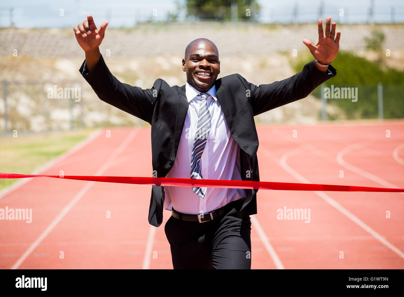 Man crossing finishing line hi-res stock photography and images - Alamy