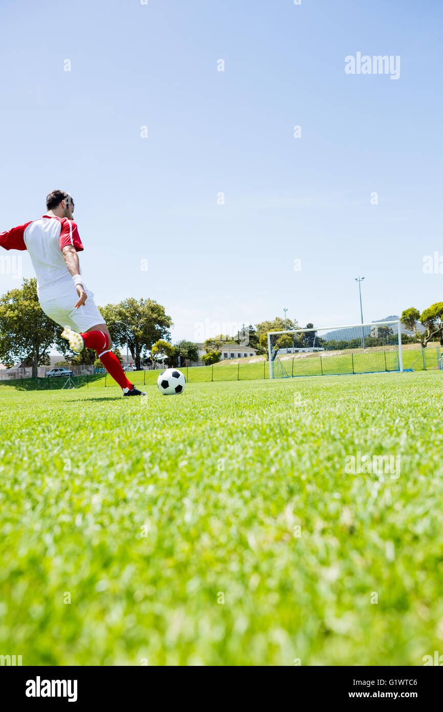 Football player practicing soccer Stock Photo - Alamy