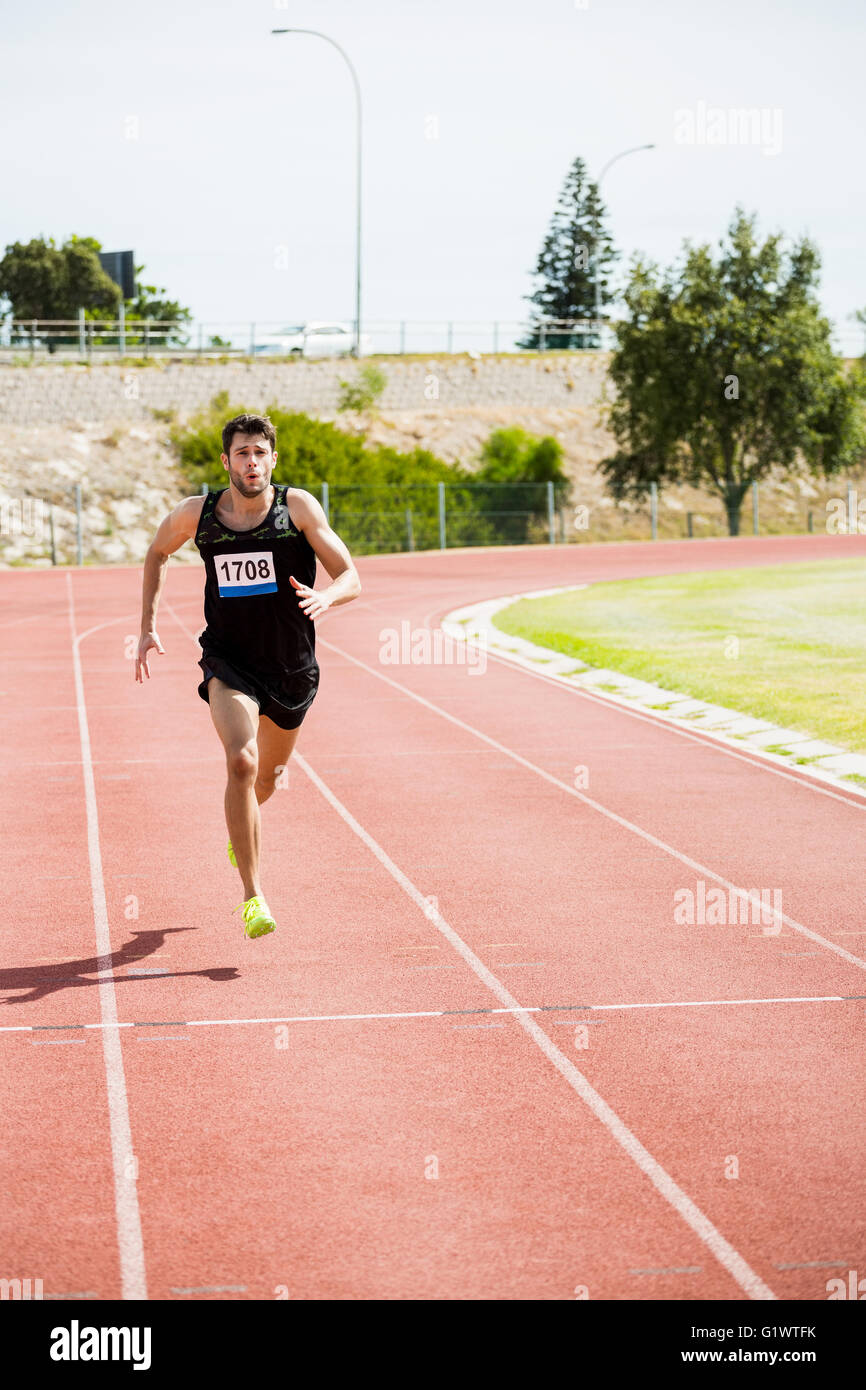 Athlete running on the racing track Stock Photo - Alamy