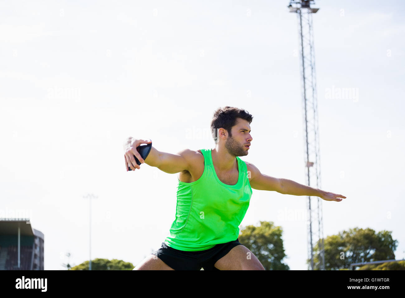Athlete about to throw a discus Stock Photo - Alamy