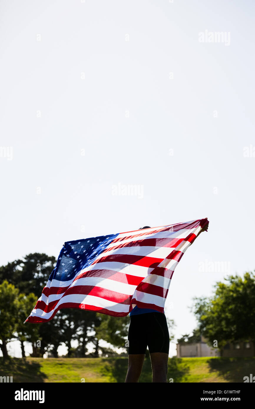 Athlete holding an american flag Stock Photo - Alamy