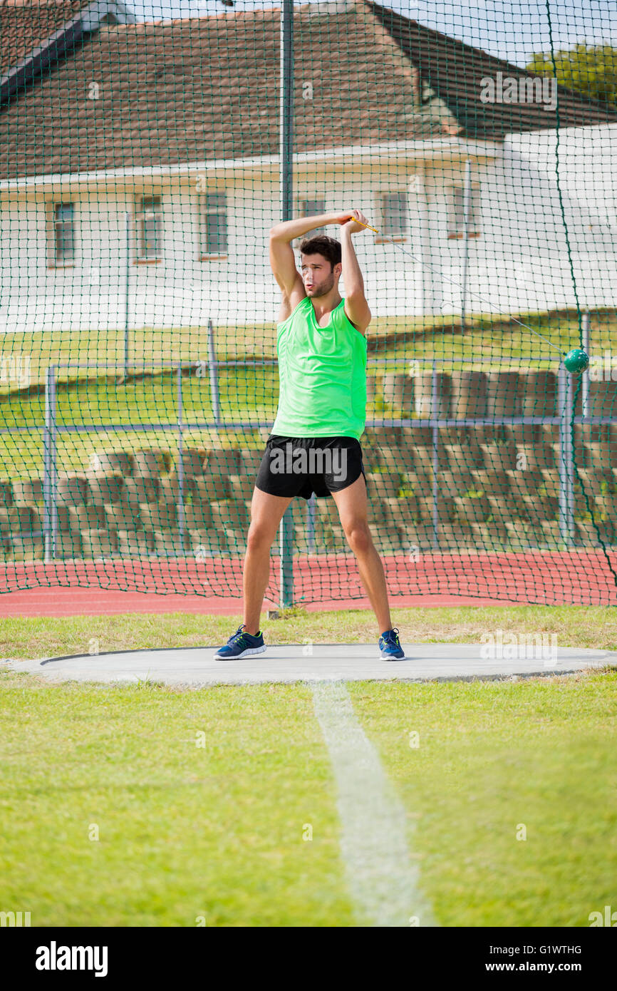 Athlete performing a hammer throw Stock Photo - Alamy