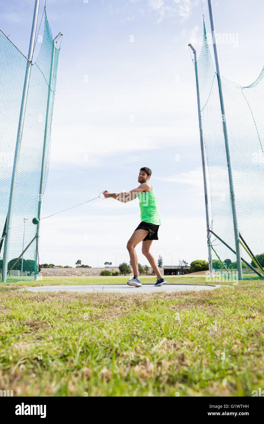 Athlete performing a hammer throw Stock Photo - Alamy