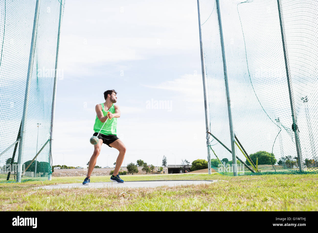 Athlete performing a hammer throw Stock Photo - Alamy