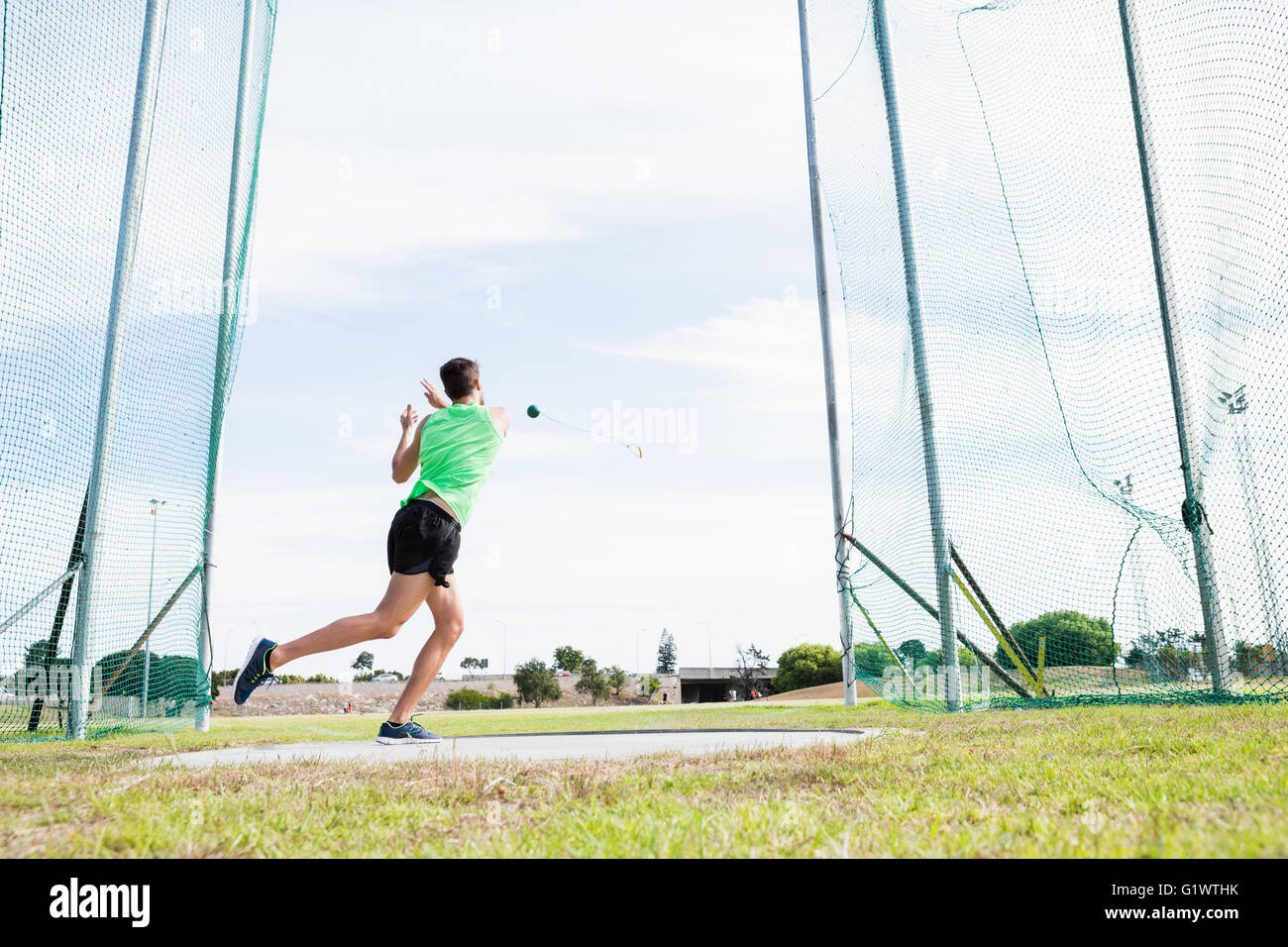 Athlete performing a hammer throw Stock Photo - Alamy