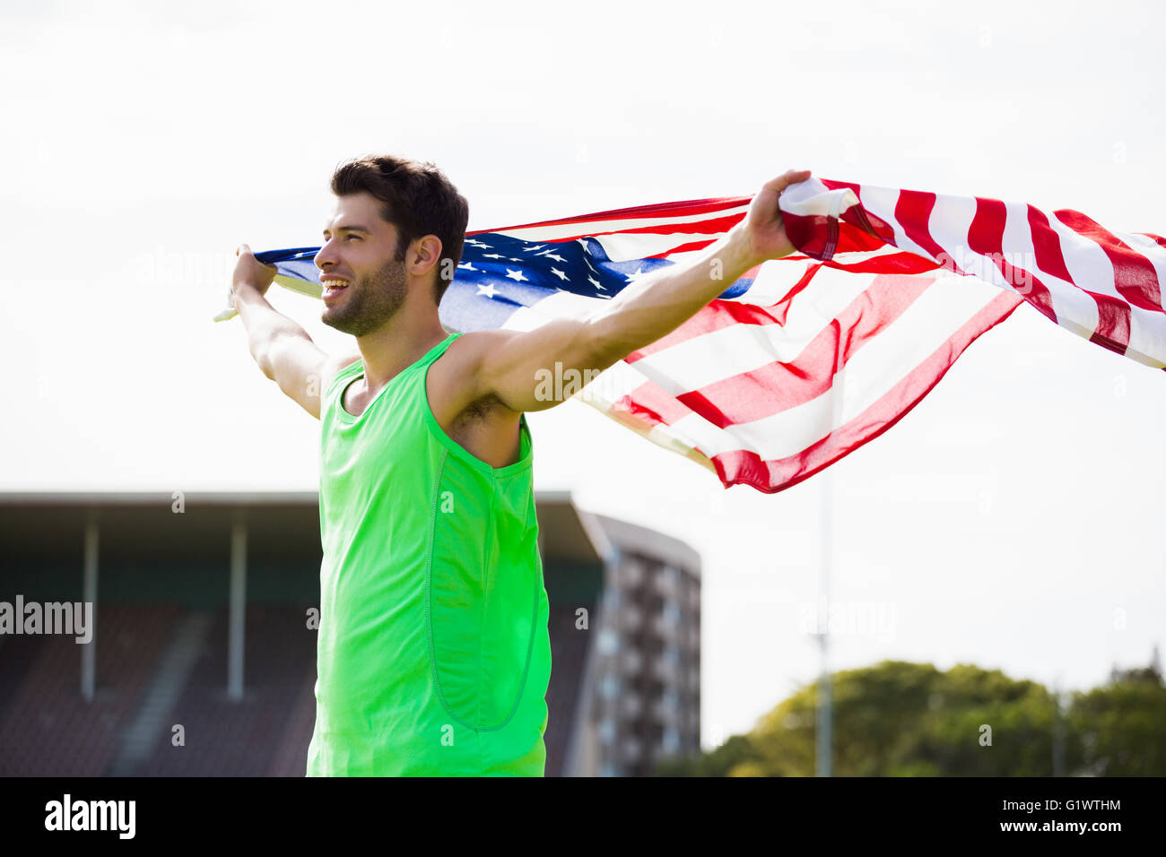 Athlete posing with american flag Stock Photo - Alamy