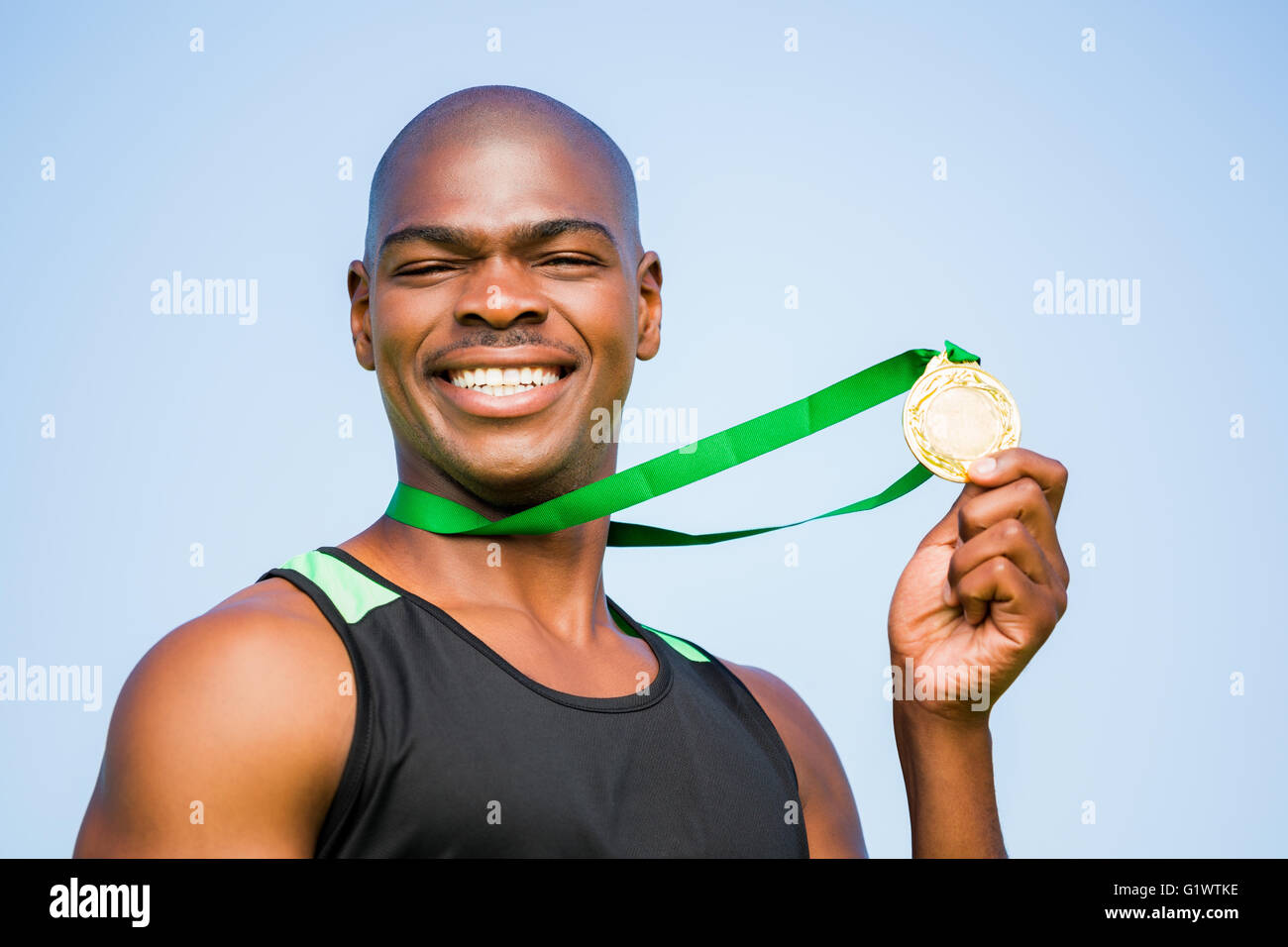 Athlete showing his gold medal Stock Photo - Alamy