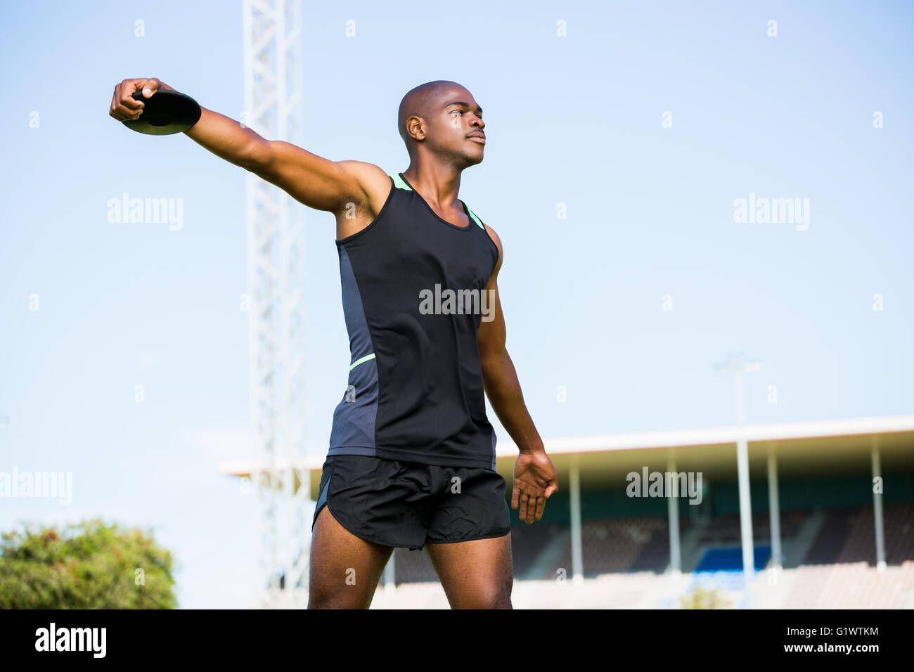 Athlete about to throw a discus Stock Photo - Alamy