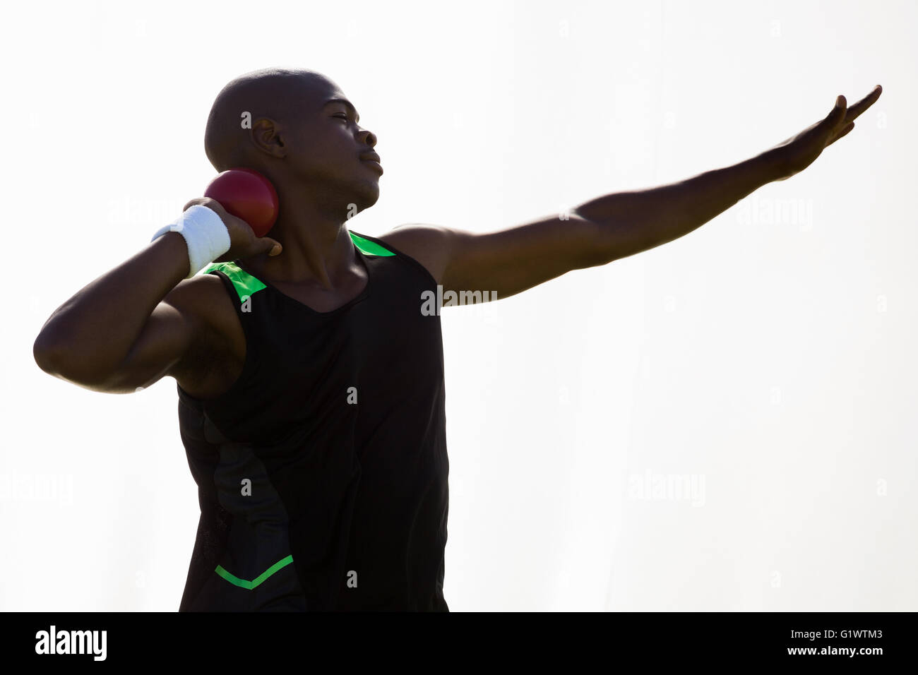 Male athlete preparing to throw shot put ball Stock Photo - Alamy