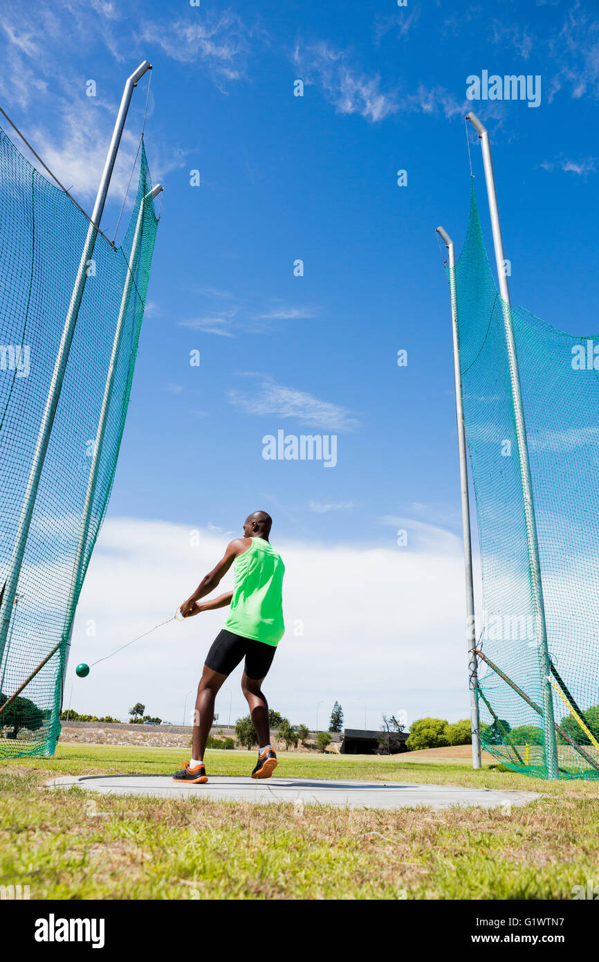 Athlete performing a hammer throw Stock Photo - Alamy