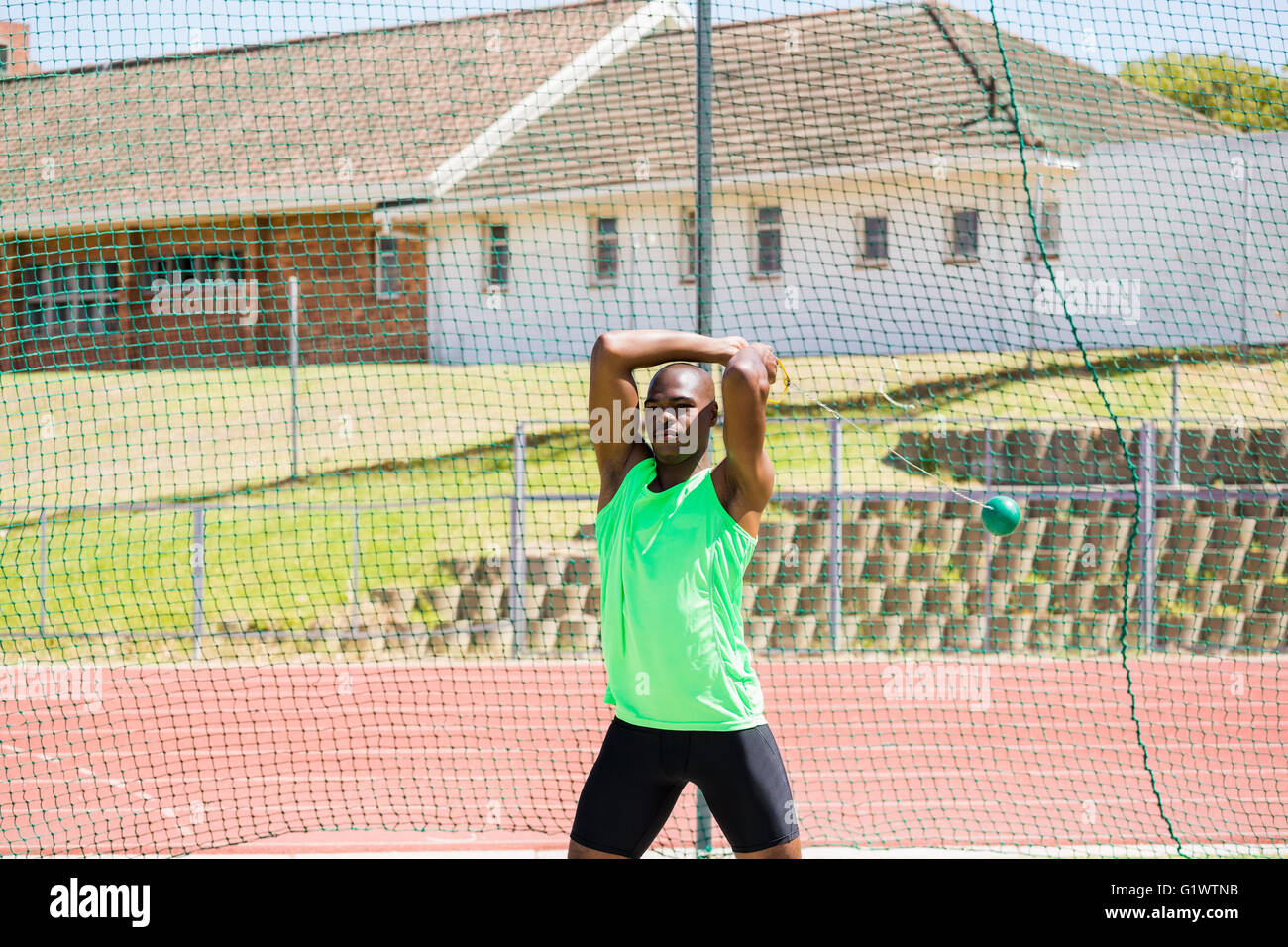 Athlete performing a hammer throw Stock Photo - Alamy