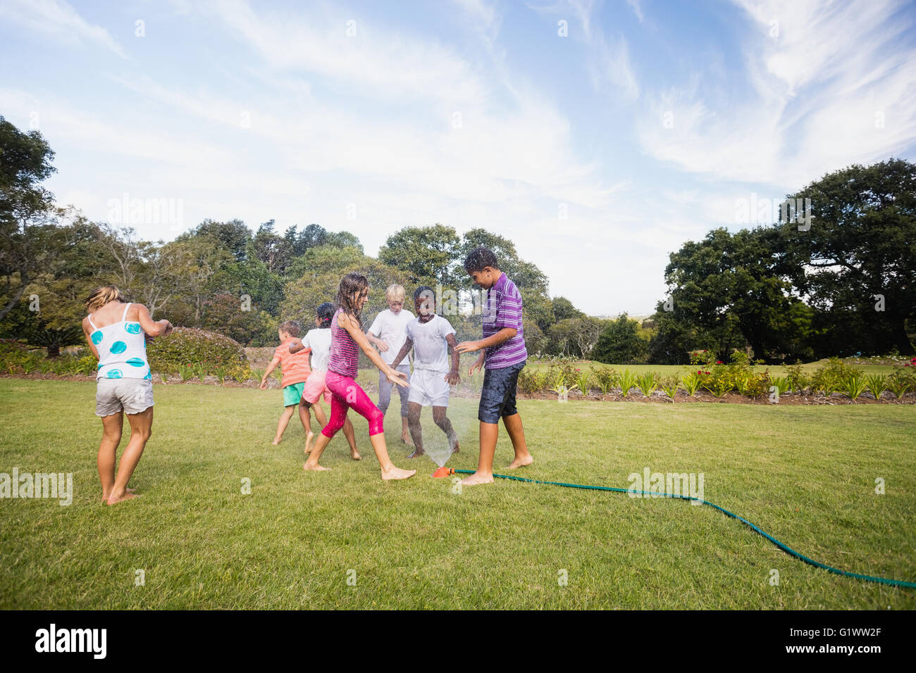 Kids playing together during a sunny day Stock Photo - Alamy