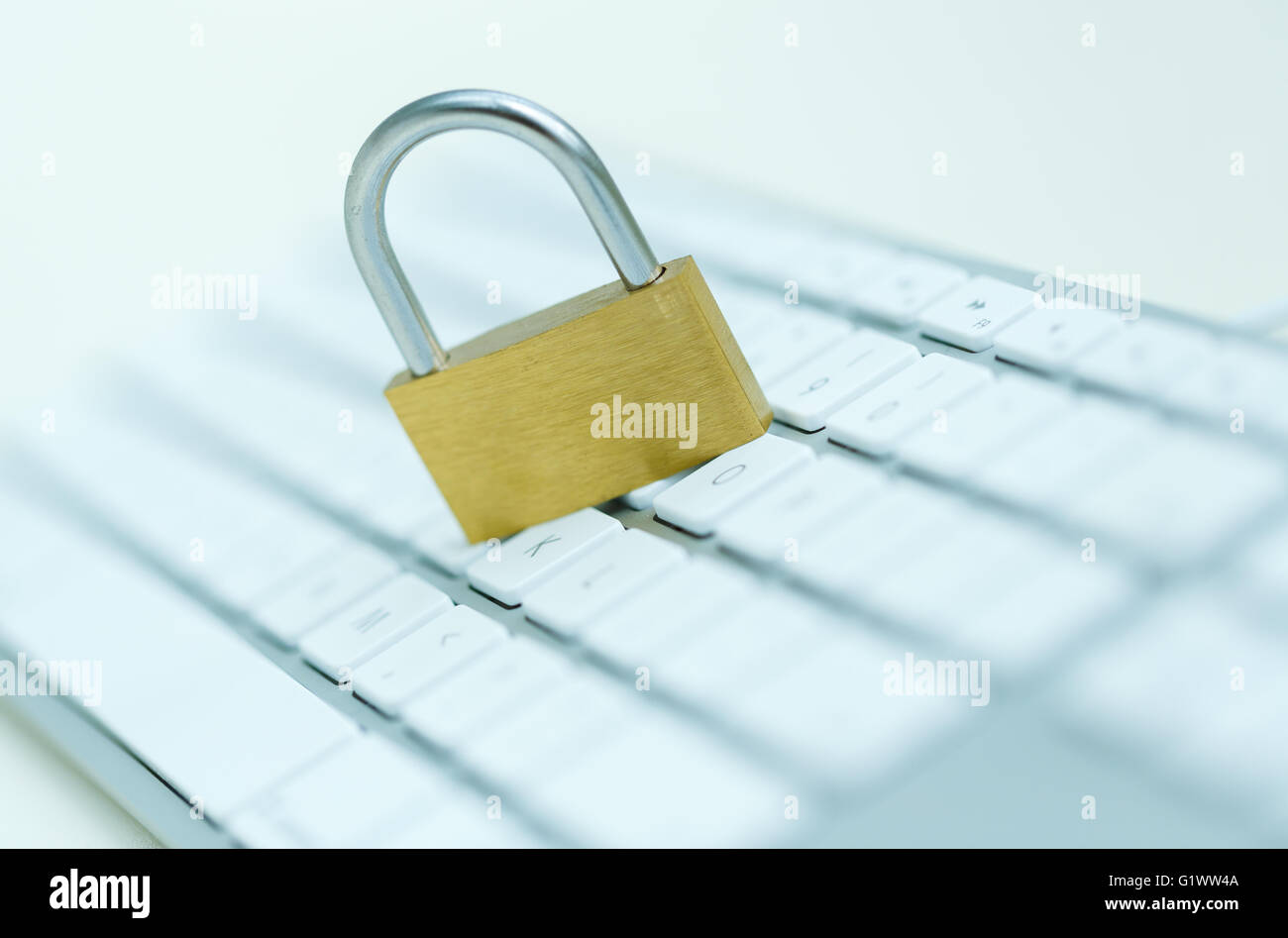 Security lock on white computer keyboard - computer security breach ...