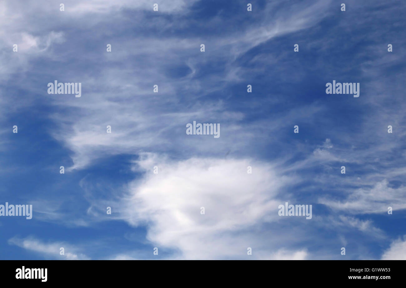 many white clouds of all shapes in the blue sky Stock Photo - Alamy