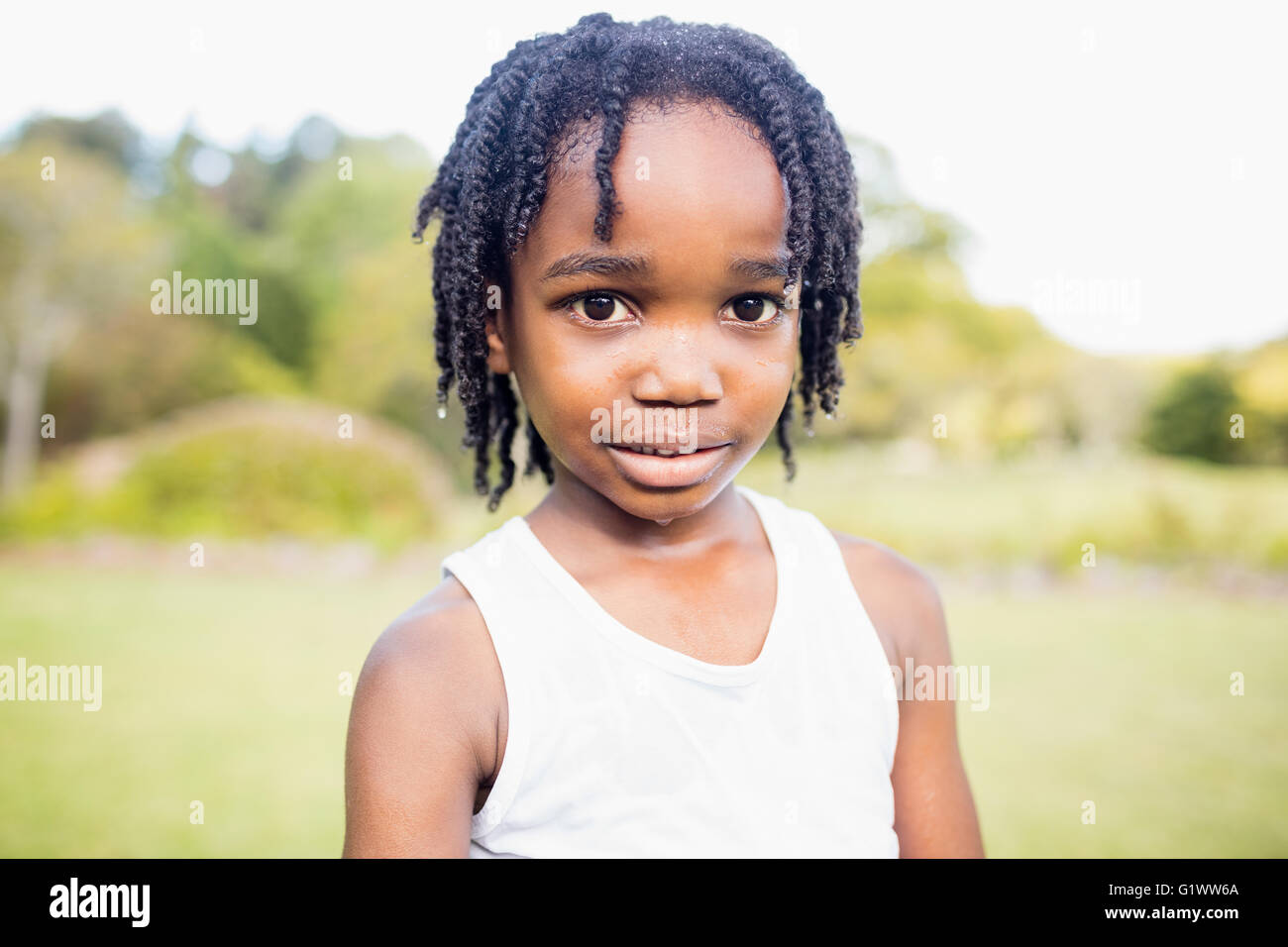 Kid posing at camera during a sunny day Stock Photo - Alamy
