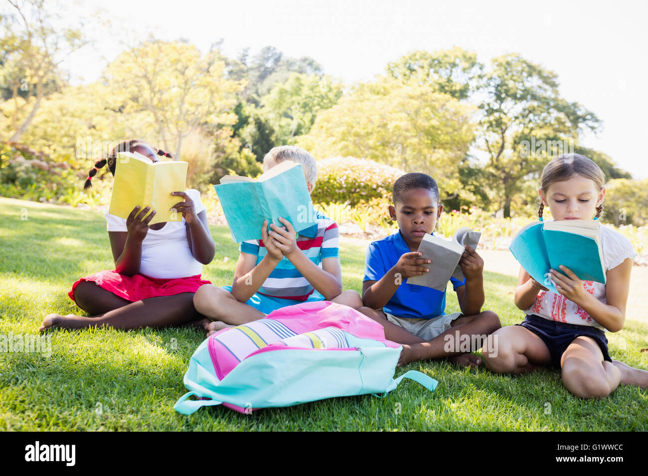 Kids reading books during a sunny day Stock Photo - Alamy