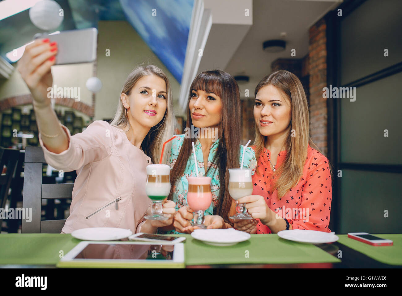 Girls with phones Stock Photo - Alamy