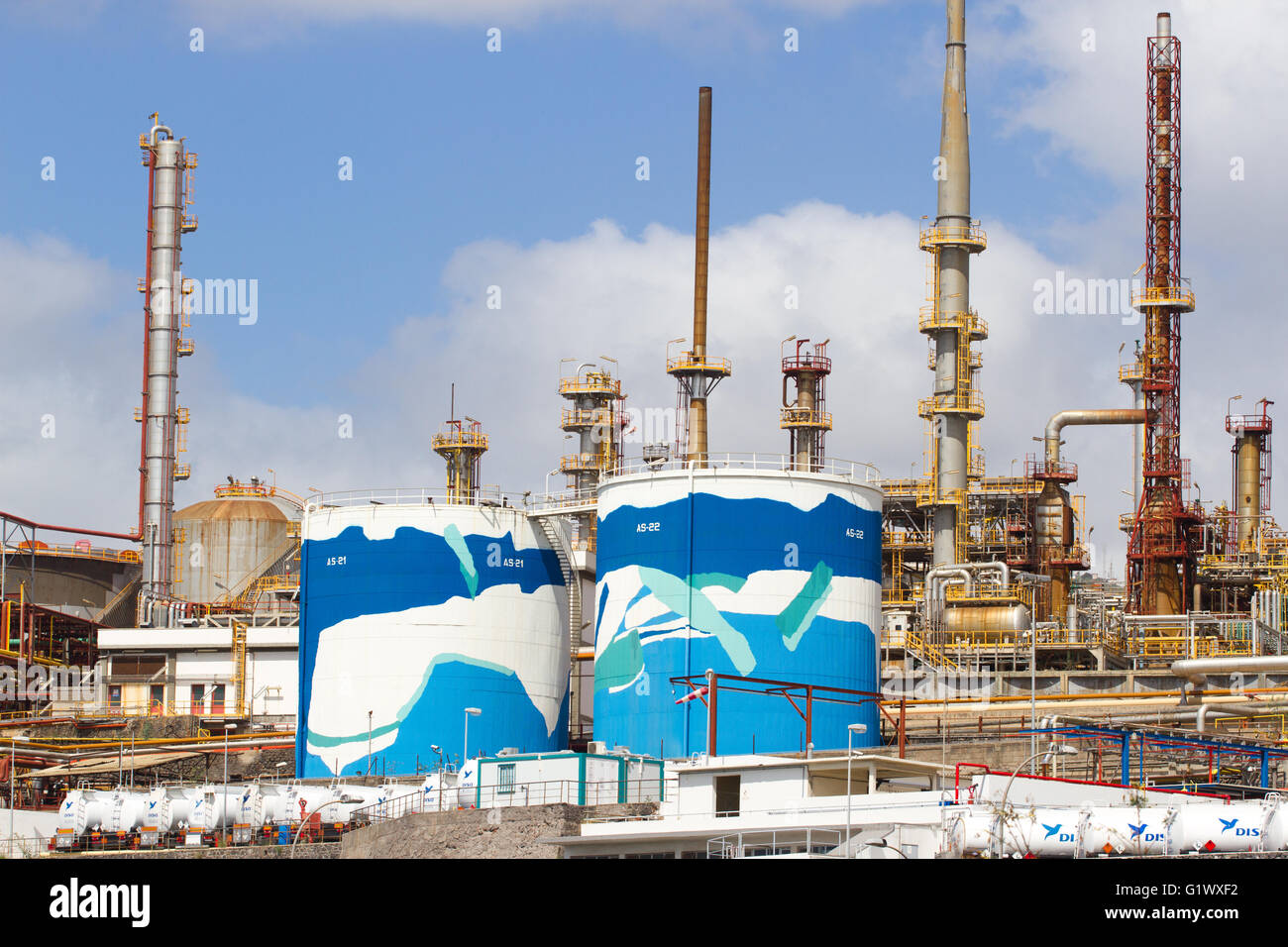 Industry vertical steaming pipe. Group of colored tubes Stock Photo - Alamy