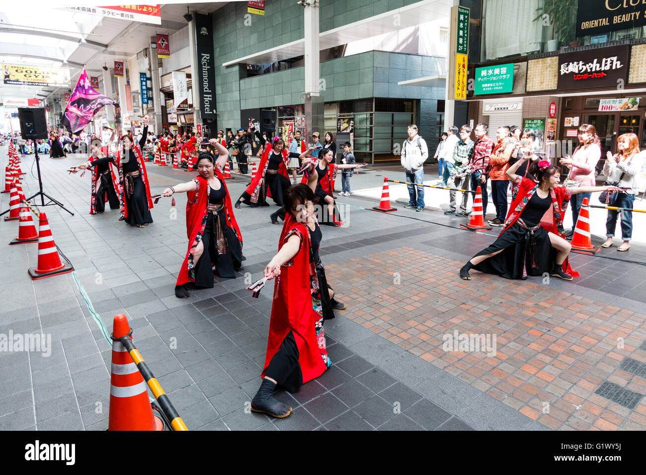 Japanese young women dance team dancing in shopping arcade before ...