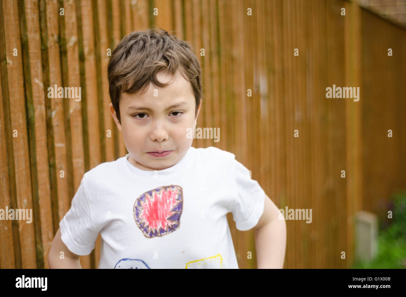 A young boy pulling his 'cross face' Stock Photo - Alamy