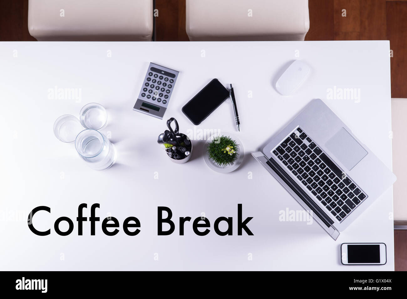 coffee break on empty meeting table as symbol Stock Photo - Alamy