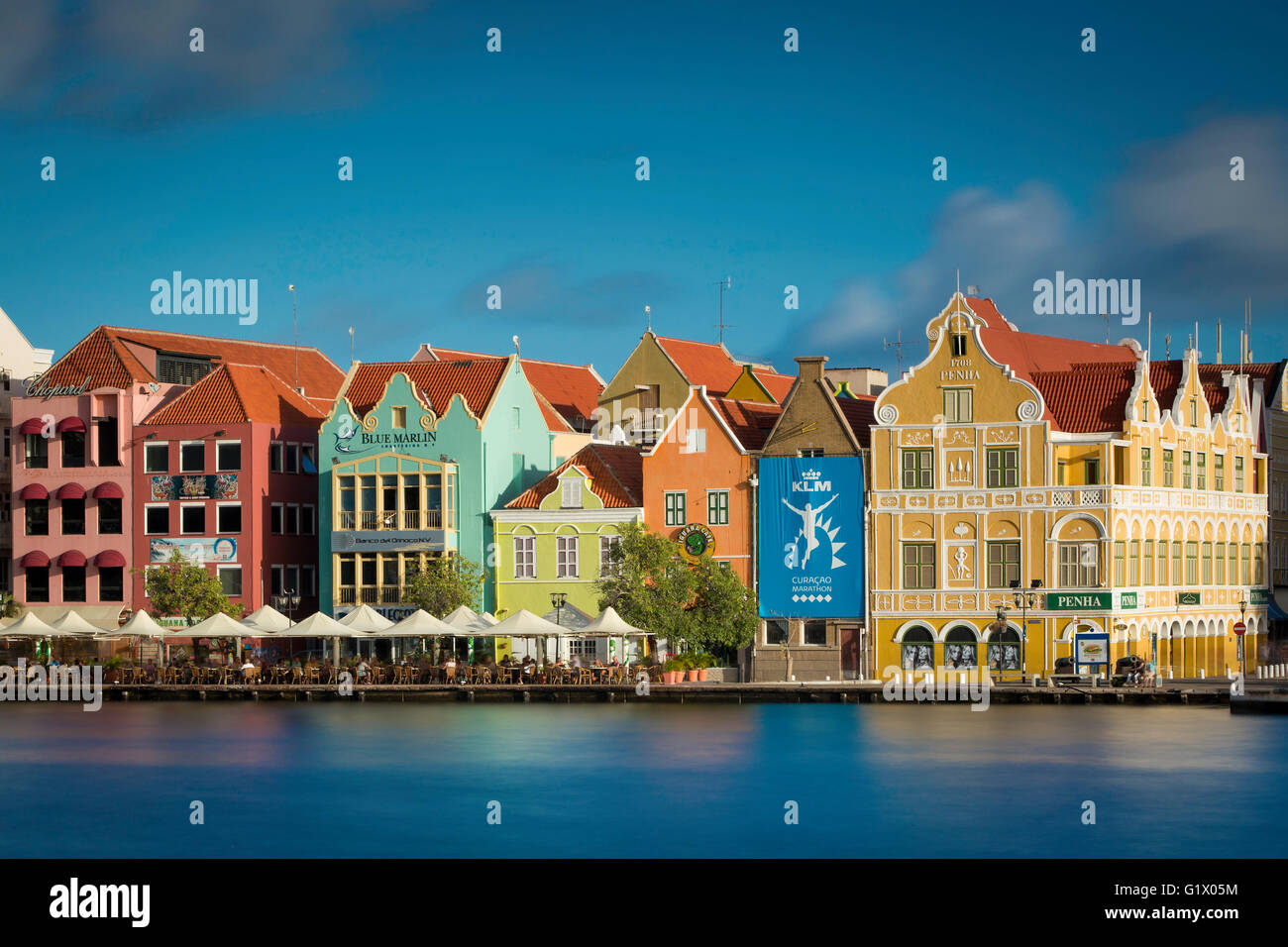Colorful Dutch architecture lines the wharf at Willemstad, Curacao ...