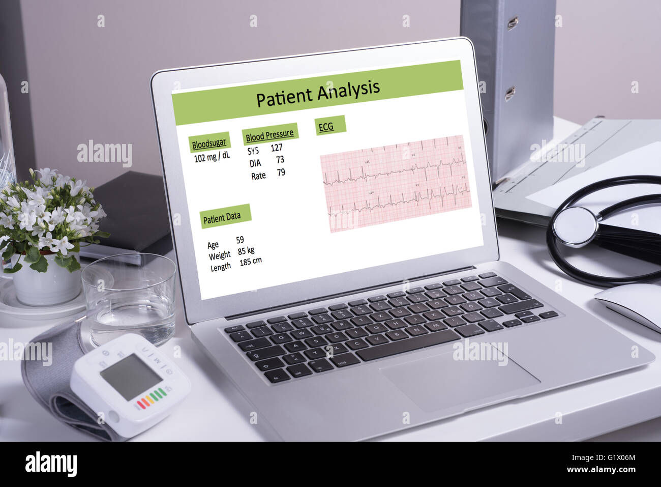 doctor's desk with patient analysis on computer screen Stock Photo - Alamy