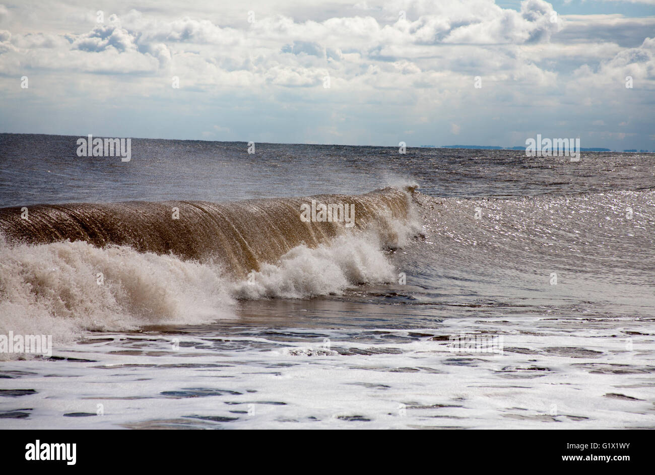 Waves breaking against the beach Skegness Lincolnshire England Stock ...