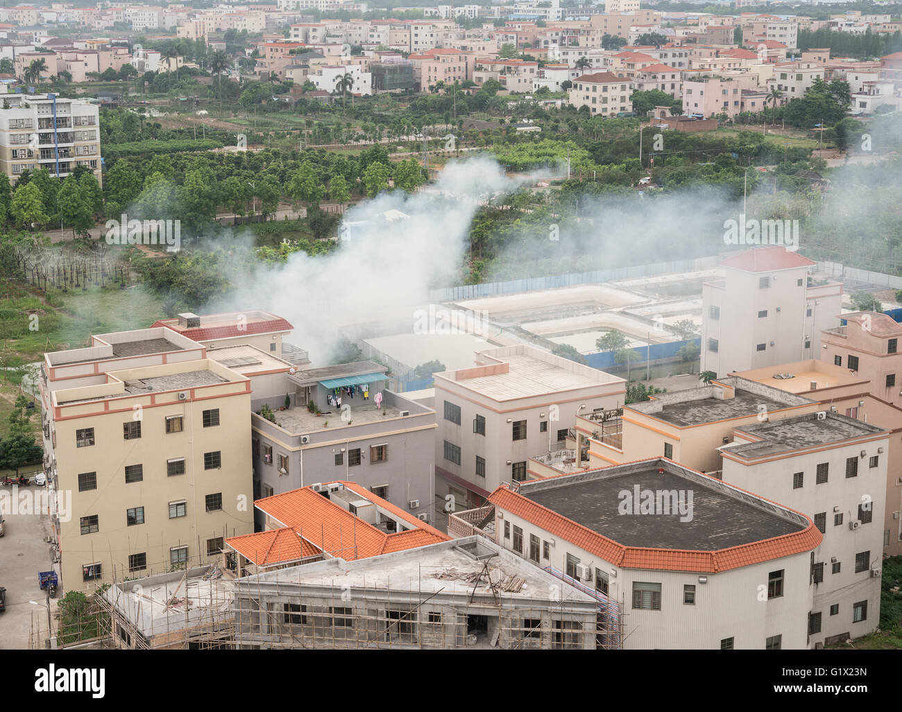 a house catches a fire with lots of smoke Stock Photo - Alamy