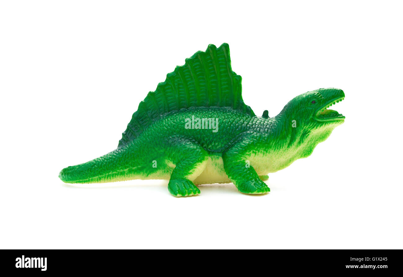 side view green dimetrodon toy on a white background Stock Photo - Alamy