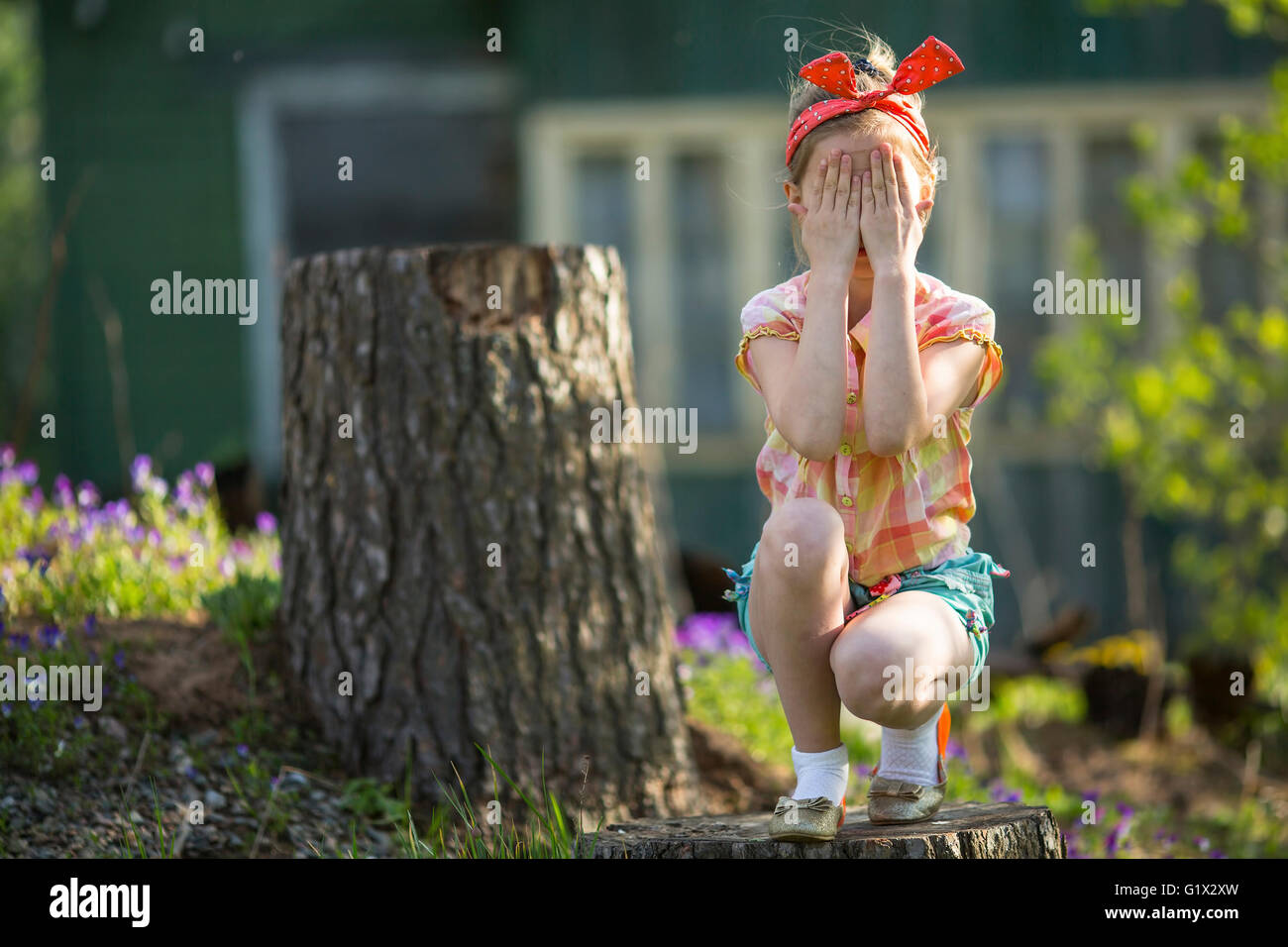 Cute little girl covering her eyes with her hands. See Nothing, Hear ...