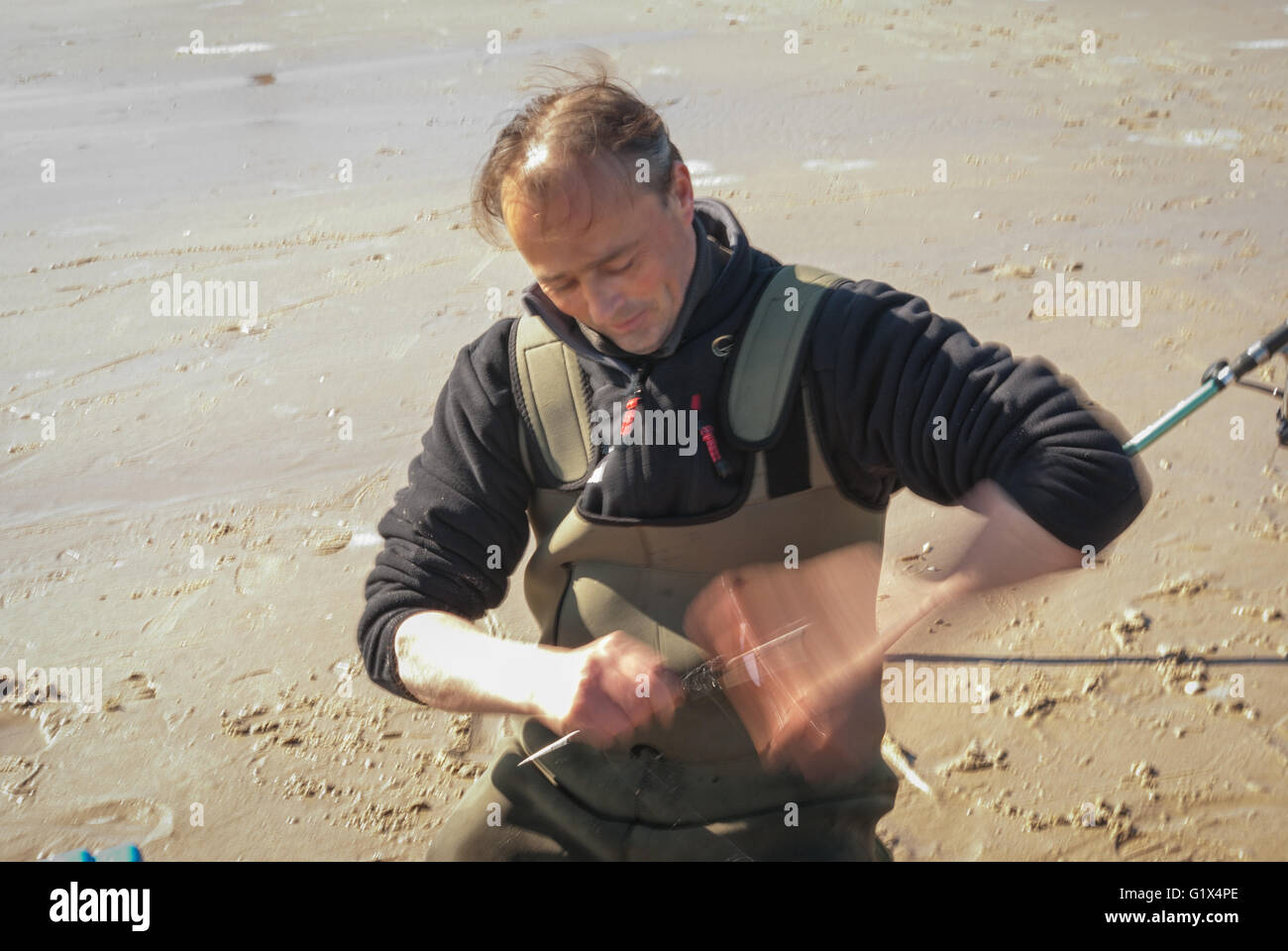 Hand holding fishing pole hi-res stock photography and images - Alamy