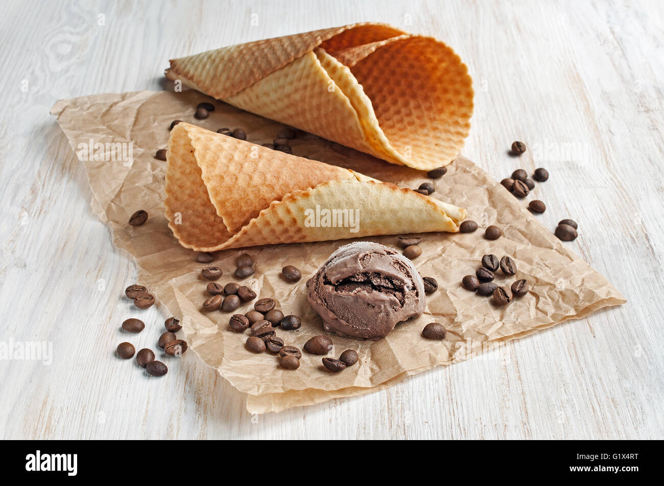 Chocolate ice cream and waffle cone on parchment paper Stock Photo - Alamy