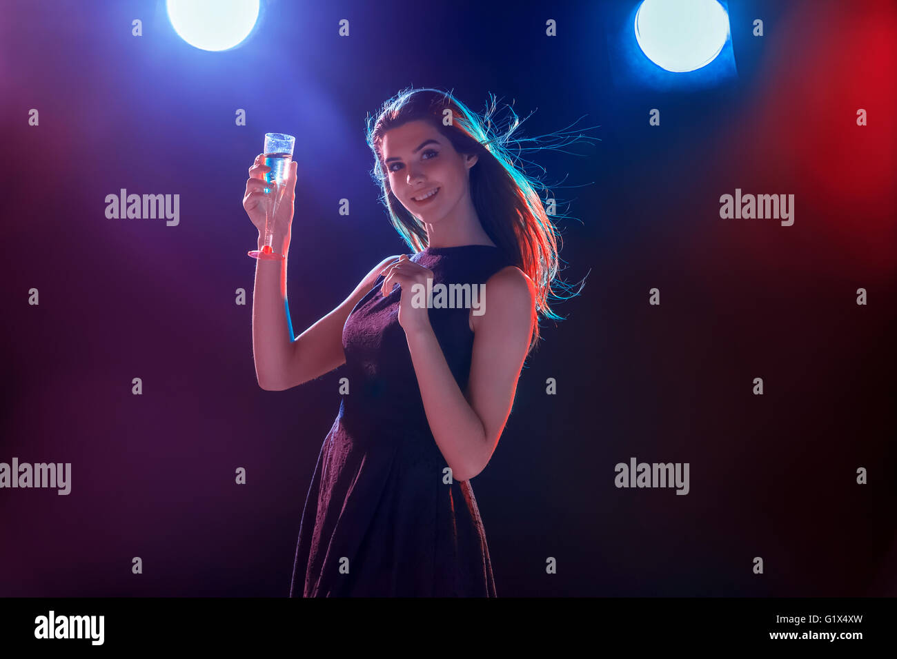 The beautiful girl dancing at the party drinking champagne Stock Photo ...