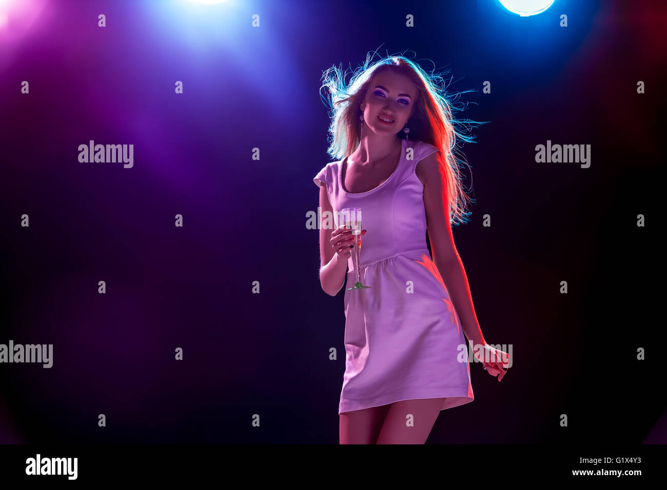 The beautiful girl dancing at the party drinking champagne Stock Photo ...