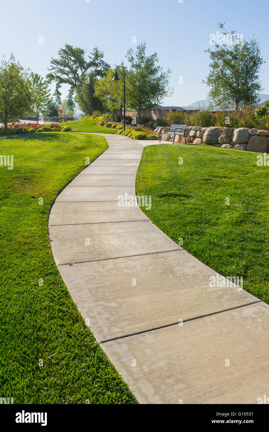 Green grass alongside curving California neighborhood sidewalk Stock ...