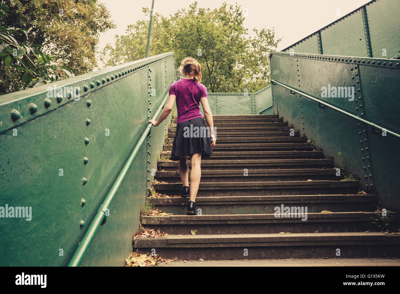 Up stairs woman skirt hi-res stock photography and images - Alamy