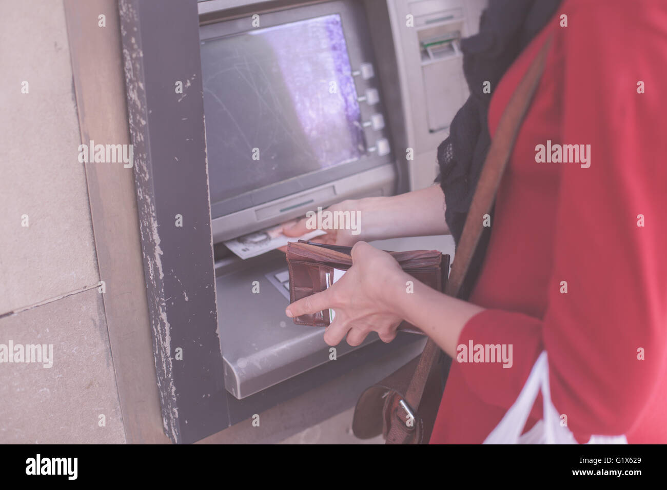 Woman withdrawing money from atm hi-res stock photography and images ...