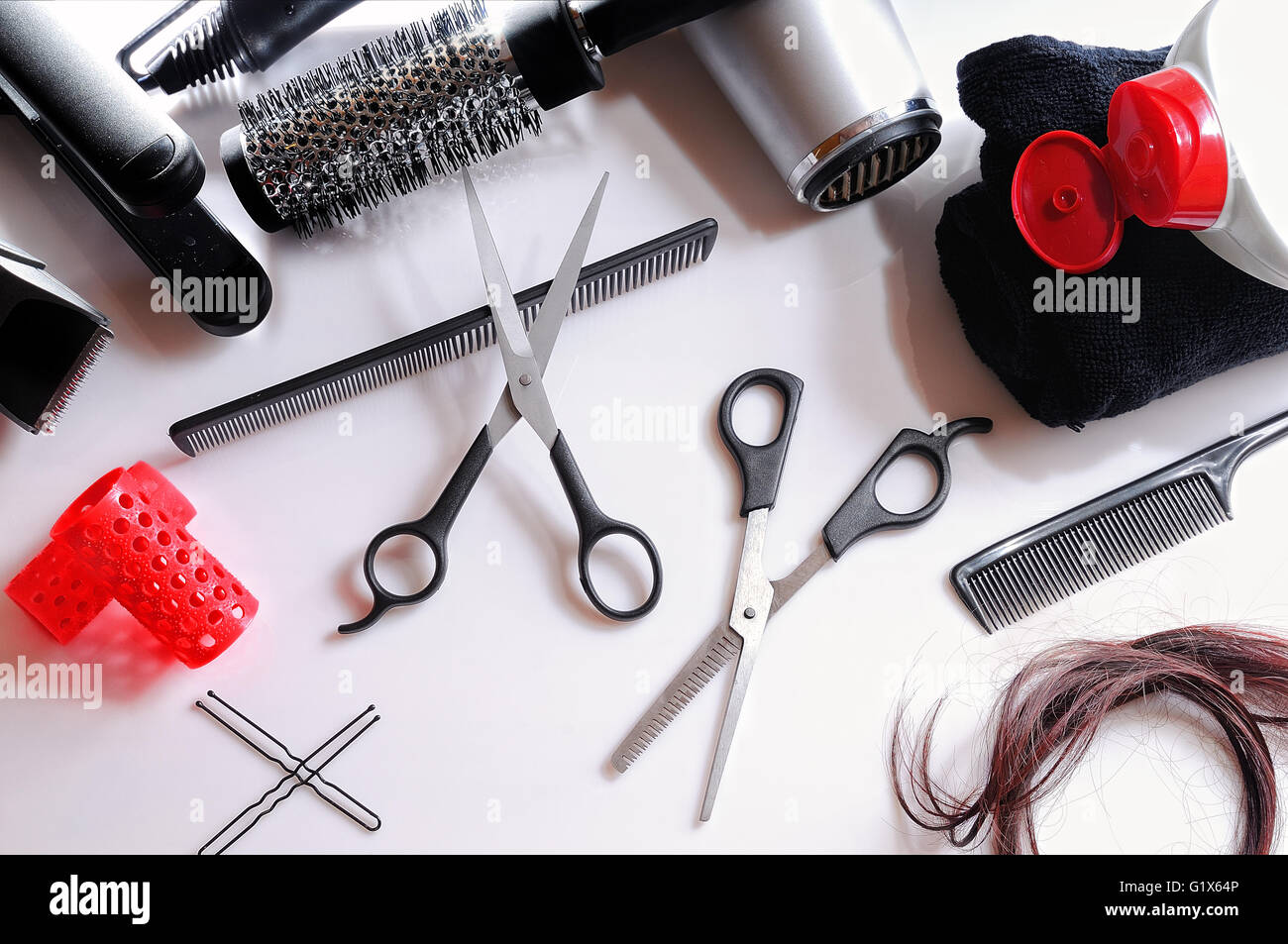 Horizontal composition hairdressing tools on a white table and white ...