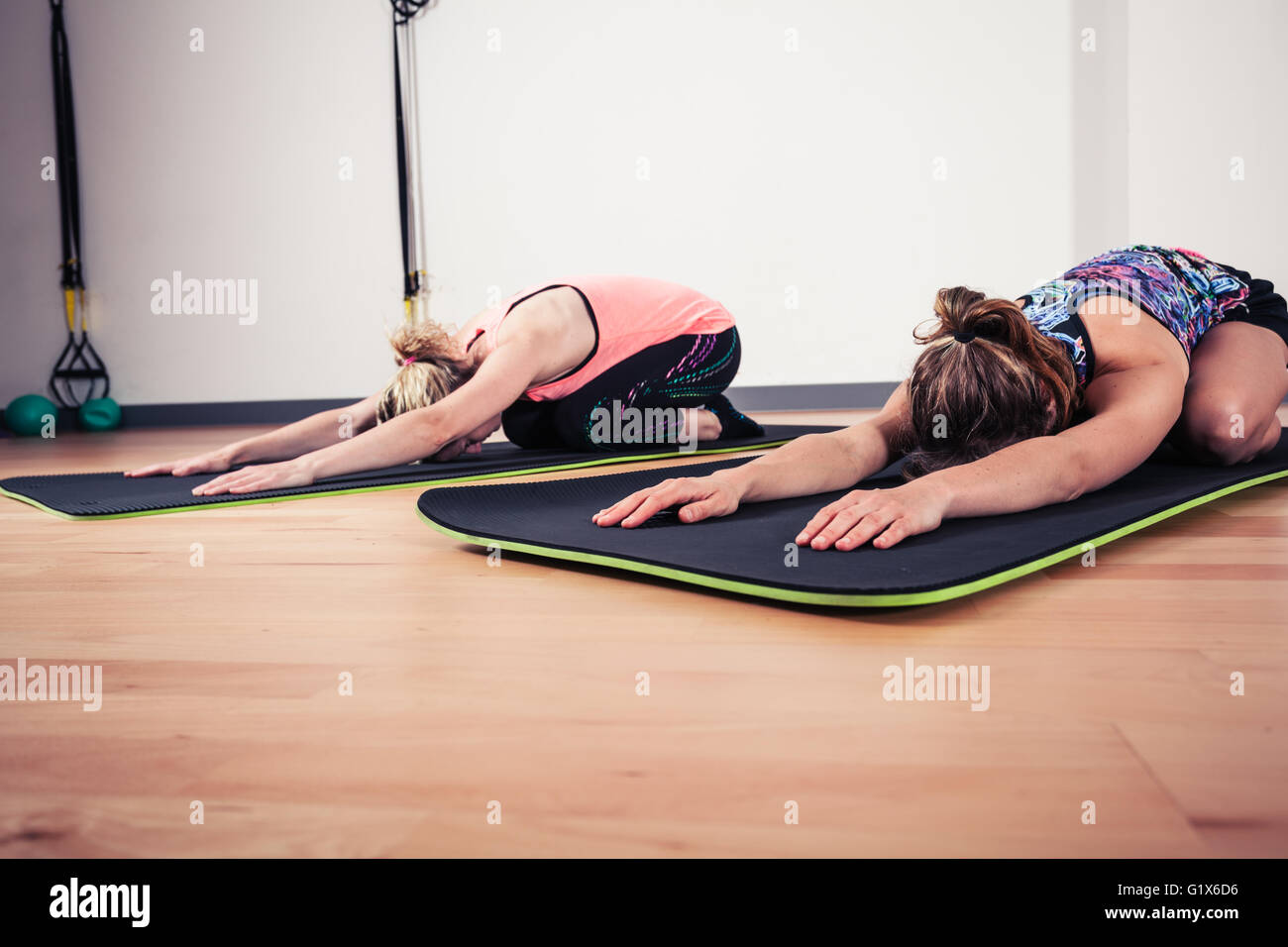 A small group of women are practising yoga in a gym Stock Photo - Alamy