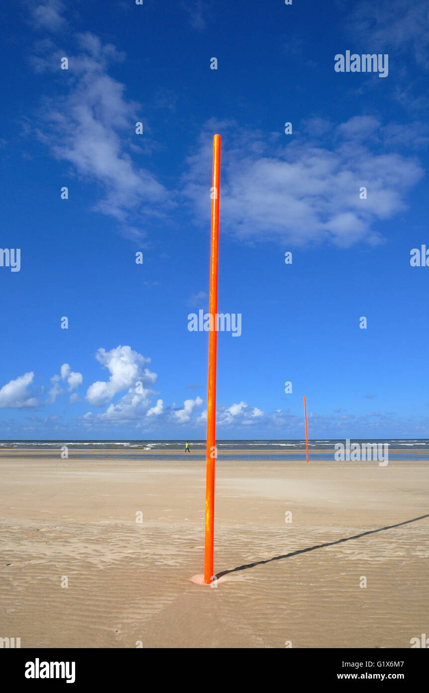 Orange-red marker posts on the beach, guarded and unguarded beach ...