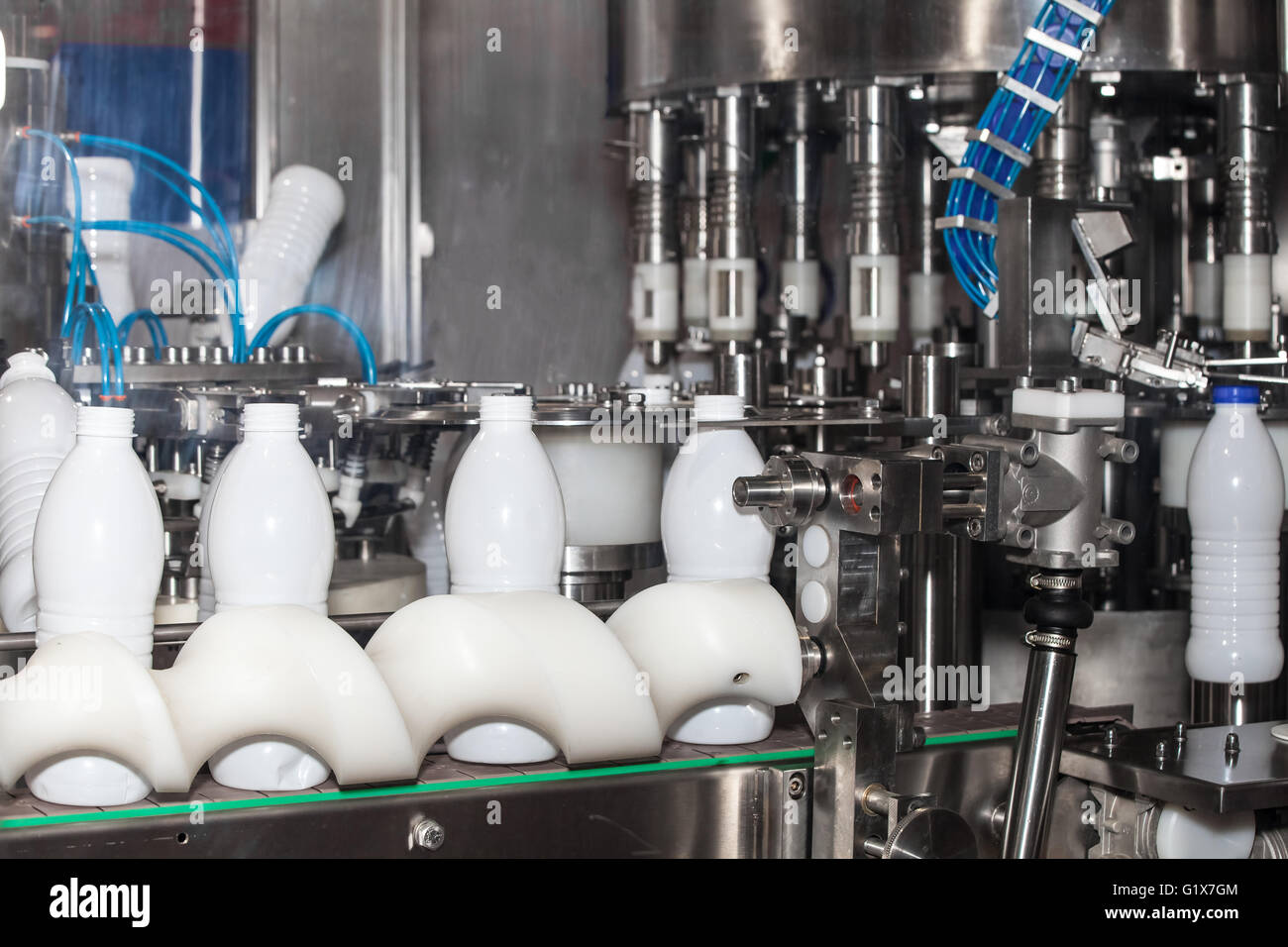 Packaging milk bottles line Stock Photo - Alamy