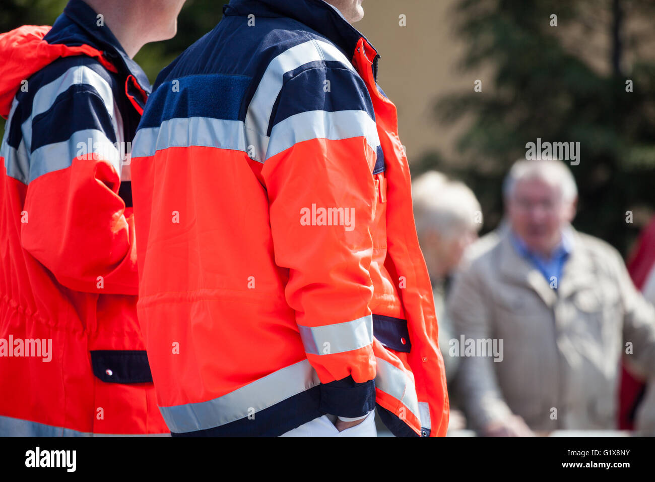 german paramedics in red Jackets on a street Stock Photo - Alamy